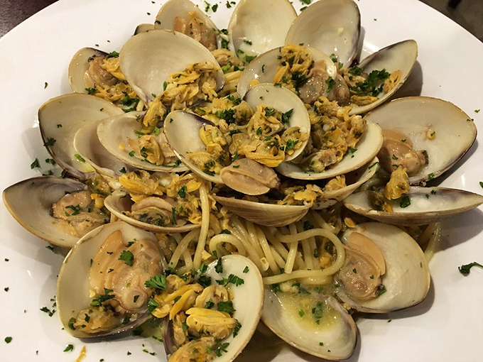 A symphony of briny clams nestled among al dente pasta, proving Dino's seafood game is just as strong as their pizza prowess.