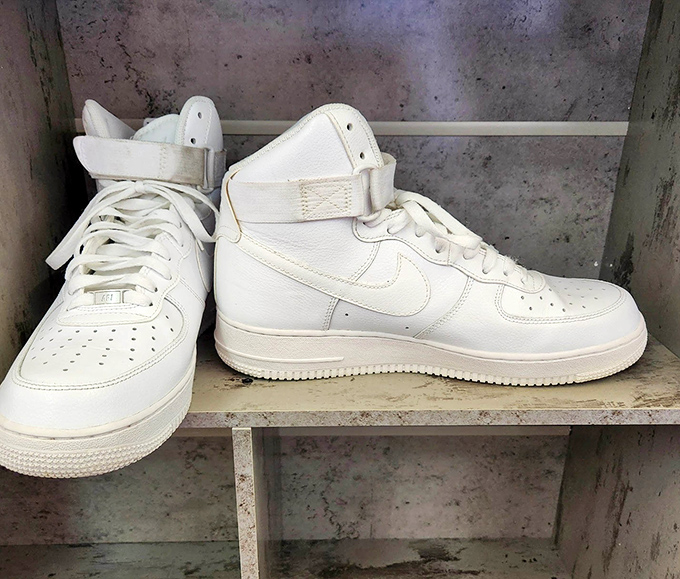 These pristine white Nike Air Force 1s sit like artifacts in a museum of cool, waiting for their next owner to give them street cred.
