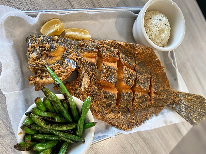 This whole fried flounder looks like it's still swimming &ndash; right through a sea of delicious seasoning and perfect crispiness.