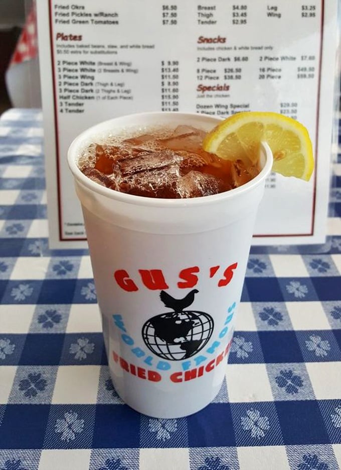 Sweet tea served in a cup that proudly bears its maker's name. In the South, this would qualify as an acceptable breakfast beverage.