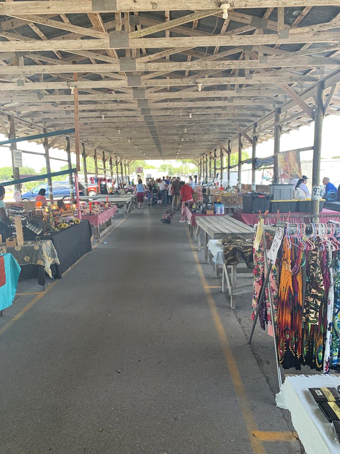 The covered market's central aisle stretches toward infinity, a treasure-lined corridor where one person's castoffs become another's prized possessions.