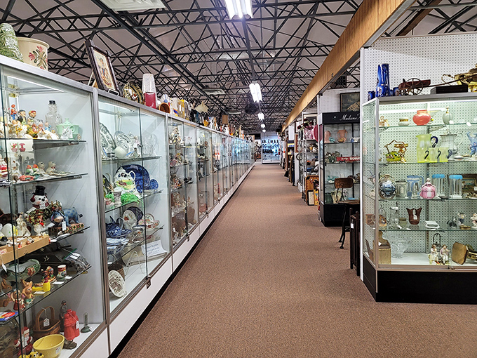 Crystal kingdoms line both sides of this aisle, each cabinet a treasure chest of delicate history waiting to catch the light.