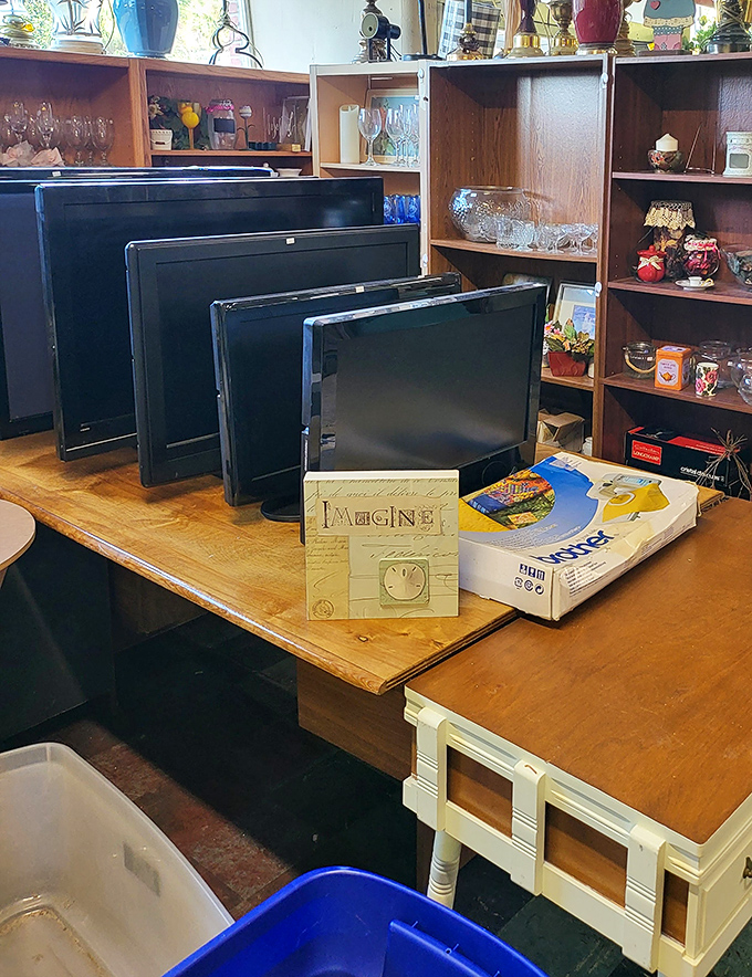 Technology's timeline displayed on a single table. From flat screens to DVD players, electronic evolution awaits its next chapter in someone else's home.