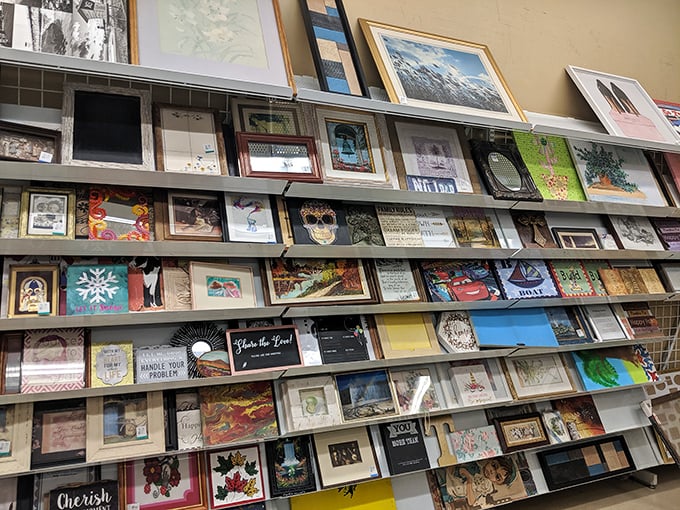 The wall of framed art offers everything from inspirational quotes to landscape paintings. Someone's former living room centerpiece awaits adoption.