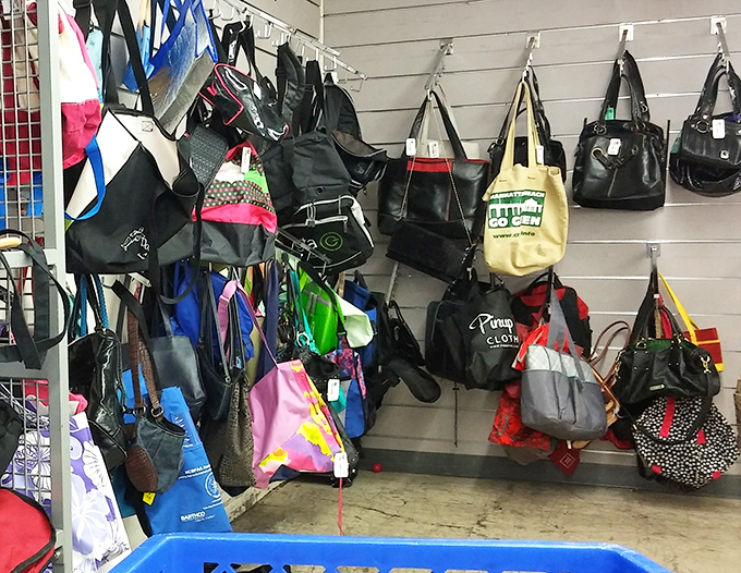 A hanging garden of handbags&mdash;from practical totes to night-on-the-town clutches&mdash;each waiting for the right shoulder to come along.