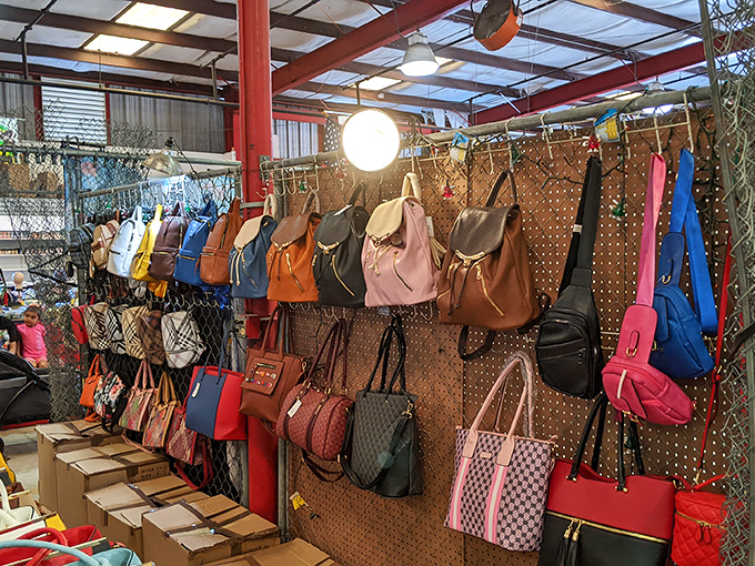 Handbag heaven! Designer-inspired purses in every color of the rainbow hang like fashionable fruit ready for the picking.