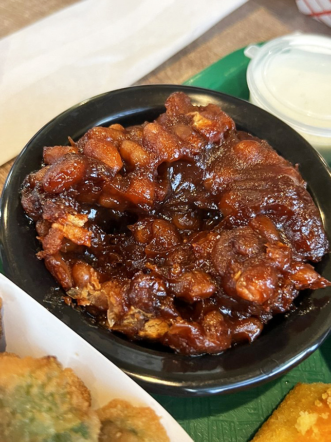 These aren't your cafeteria baked beans&mdash;they're sweet, tangy little flavor bombs that have been simmering their way to perfection.