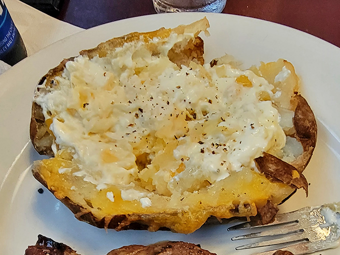 The humble baked potato, transformed into a canvas of creamy indulgence. Whoever said "it's what's inside that counts" clearly had this spud in mind.