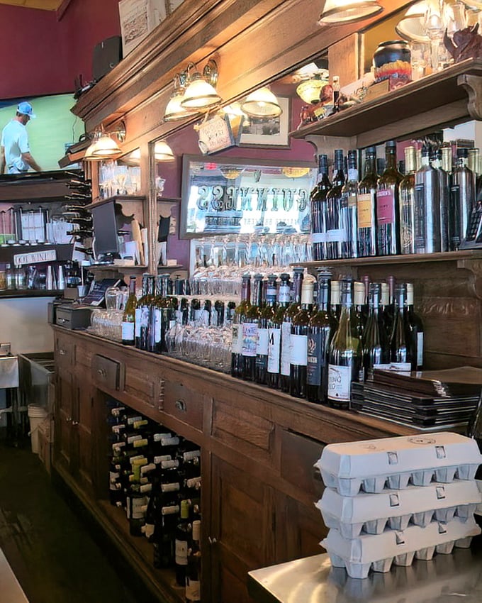 The bar isn't just stocked&mdash;it's curated, with bottles standing at attention like soldiers guarding the gateway to a good time.