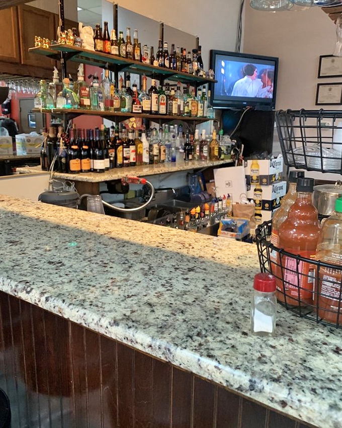 The bar isn't just stocked &ndash; it's a liquid library of possibilities, with bottles standing at attention ready to complement your Filipino feast. 