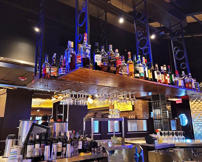 The bar doesn't just serve drinks&mdash;it showcases them, with bottles displayed like trophies and glasses hanging like crystal stalactites ready for your celebration.