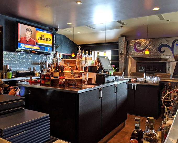 The bar area: where cocktail craftsmanship meets sports-watching comfort. The kind of place where both Manhattan the drink and Manhattan the borough would feel at home.