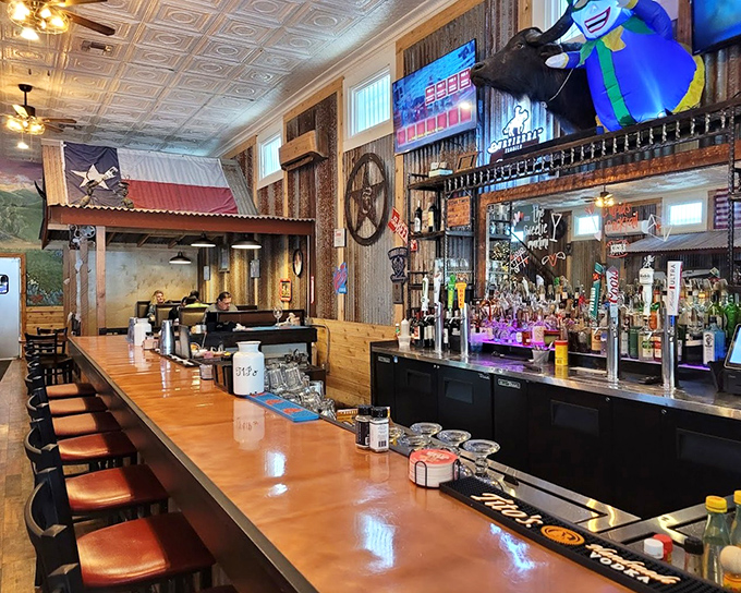 The bar area serves as Bandera's unofficial town hall, where strangers become friends and friends become family over cold drinks and warm conversation.