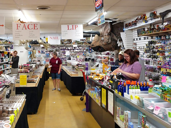Beauty products galore under the watchful eye of... is that a mounted deer head? Only at Q-Mart!