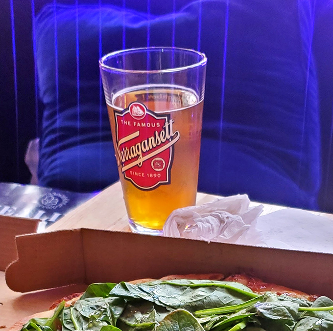 Nothing complements a slice like a cold Narragansett, especially when surrounded by electric blue lighting that makes you feel like you're dining in a lava lamp.