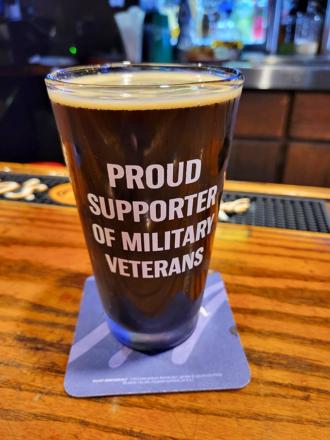 A pint glass that speaks volumes about the establishment's values. The perfect vessel for a cold one after a long day.