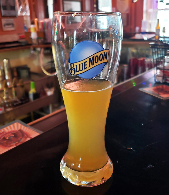 A half-finished Blue Moon catching the light just right. Because great barbecue deserves a proper liquid companion on its journey to your soul.