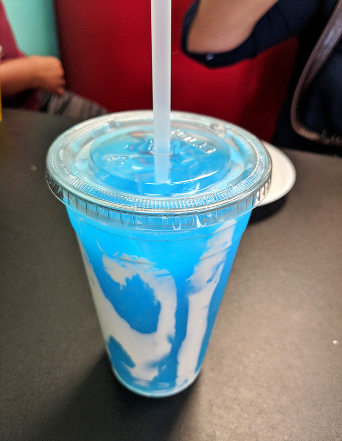 That blue swirl isn't just a drink&mdash;it's summer in a cup, the kind of vibrant concoction that makes adults remember what it felt like to be kids.