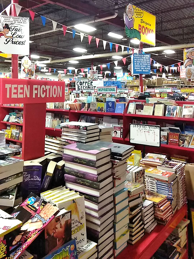 Book towers that would make any bibliophile weak in the knees. The only thing better than a good book is a good book at 70% off.