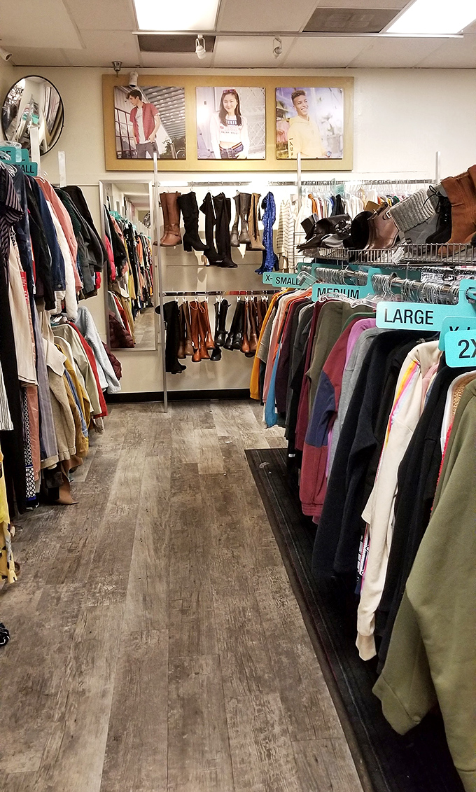 Size markers in cheerful turquoise organize the chaos, turning what could be a clothing avalanche into a navigable fashion adventure.