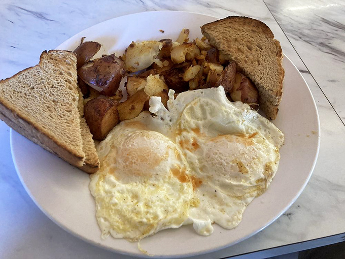 The classic two-eggs-any-style breakfast: proof that sometimes the simplest things require the most expertise to perfect.
