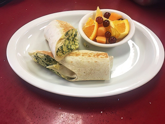 A breakfast wrap that proves vegetables can be morning heroes too, especially when paired with fresh fruit that actually tastes like fruit.