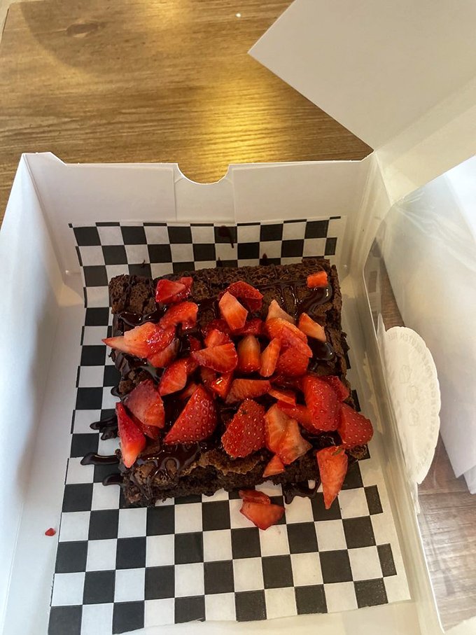 A brownie that doesn't just have strawberries on top&mdash;it's wearing them like a crown. Chocolate royalty deserves nothing less.