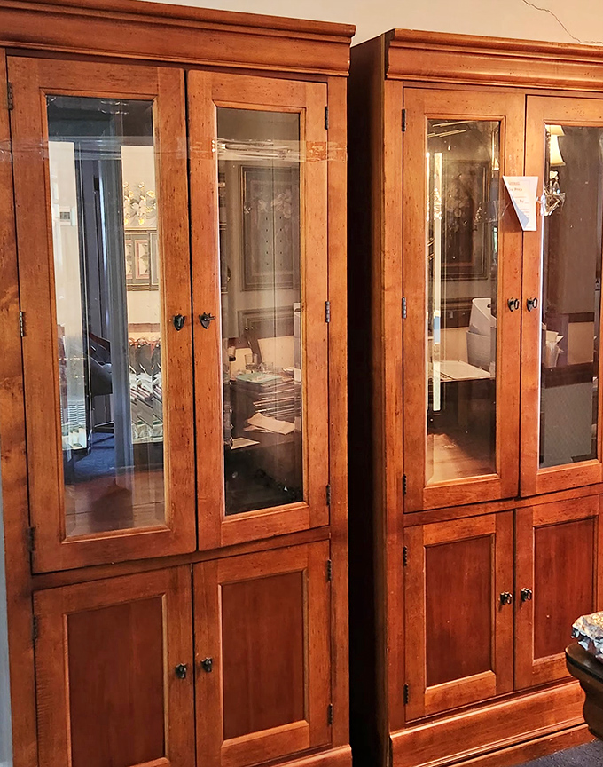 Solid wood cabinets with glass doors that whisper tales of family dinners and holiday displays. Quality furniture waiting for its next chapter.