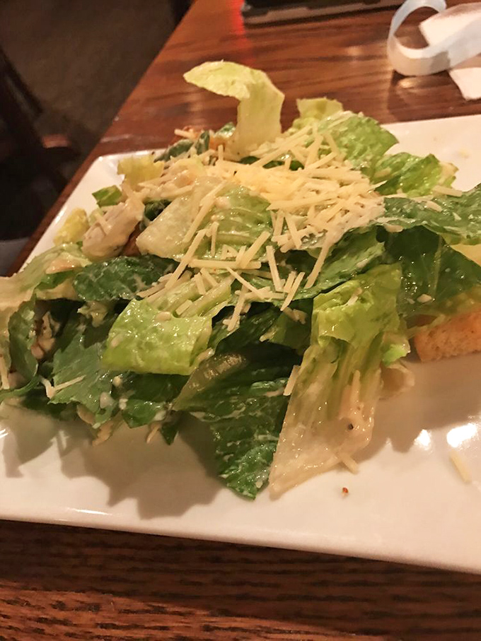 Even their Caesar salad gets the coastal treatment with fresh romaine, house-made dressing, and generous shavings of parmesan.