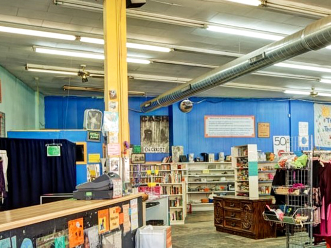 The checkout area doubles as a book nook, where literary treasures await adoption alongside vintage finds.