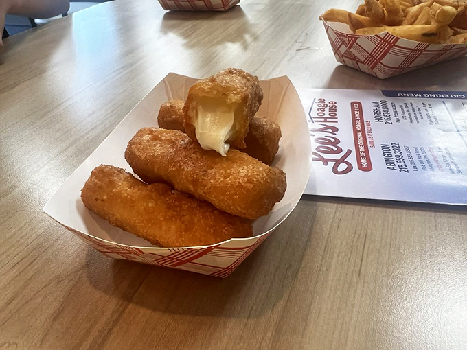 Mozzarella sticks achieving that perfect cheese-pull moment that makes your inner child do a happy dance.