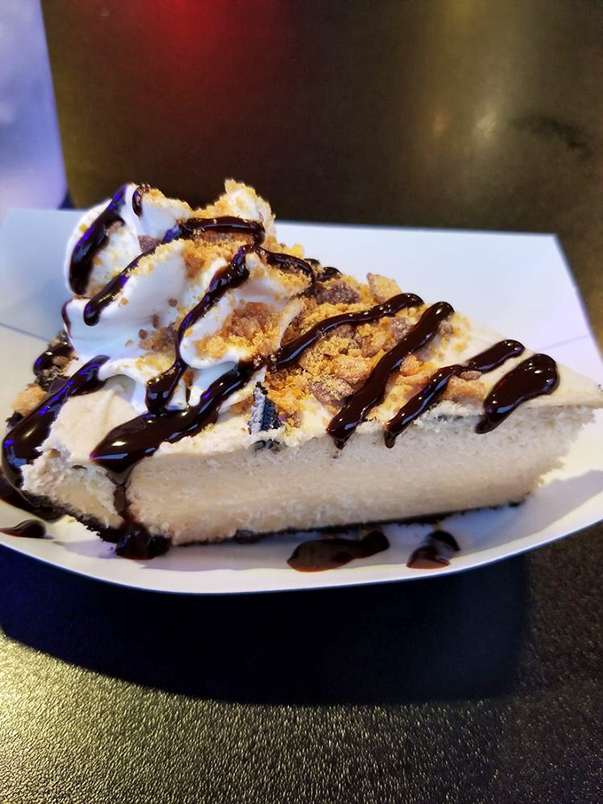 Cheesecake gets the Hawg Heaven treatment with crumbled toppings and chocolate drizzle&mdash;proof that even desserts deserve a little barbecue joint swagger.