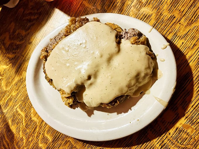 The chicken fried steak disappears under a blanket of peppery cream gravy&mdash;a dish that's less about looking pretty and more about pure, unadulterated pleasure.