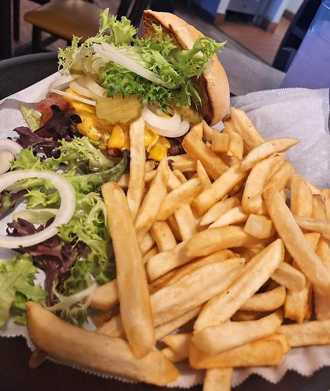 This burger doesn't need fancy toppings or artisanal buns&mdash;just fresh ingredients, proper seasoning, and fries that could stand alone as a meal.