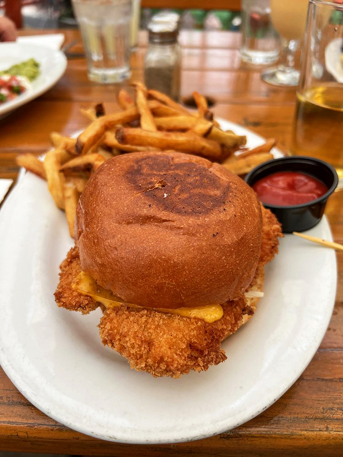 This isn't just a chicken sandwich; it's a crispy, golden monument to what happens when simple ingredients meet serious culinary skill.