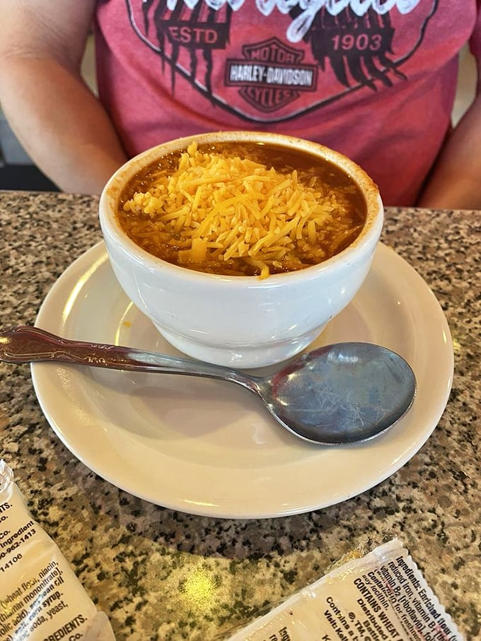 A bowl of chili topped with melted cheese that doesn't just warm your stomach but somehow manages to hug your soul.