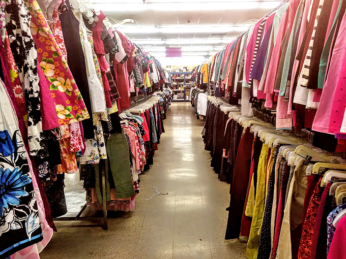 The women's clothing section stretches into infinity, a kaleidoscope of colors and patterns where patience yields fashion gold.