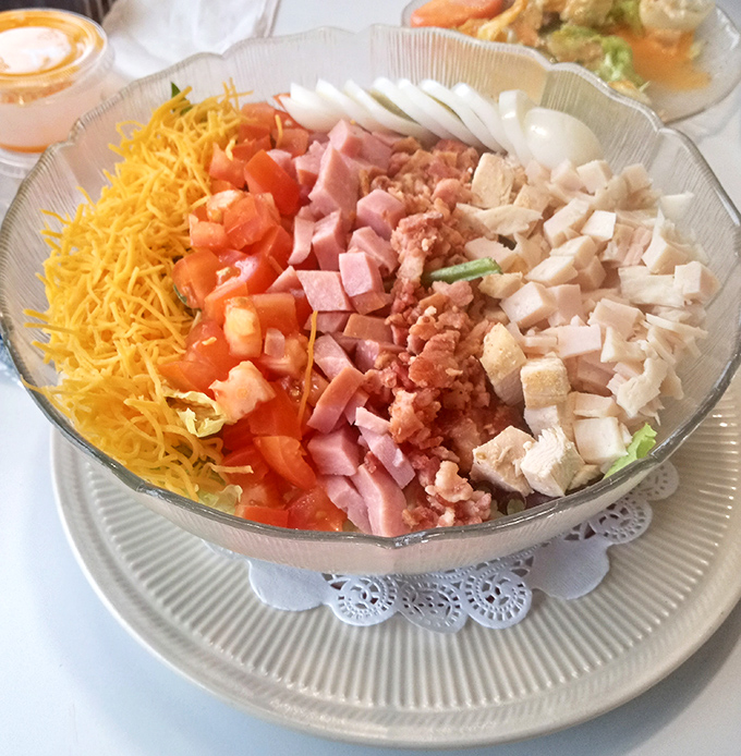 This Cobb salad isn't just arranged&mdash;it's choreographed, with each ingredient performing its role in perfect harmony on the culinary stage.