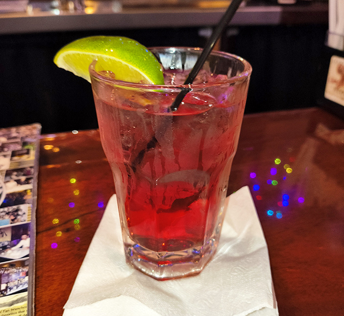 That cranberry cocktail glows like liquid rubies, promising to make any Monday feel like Friday night.