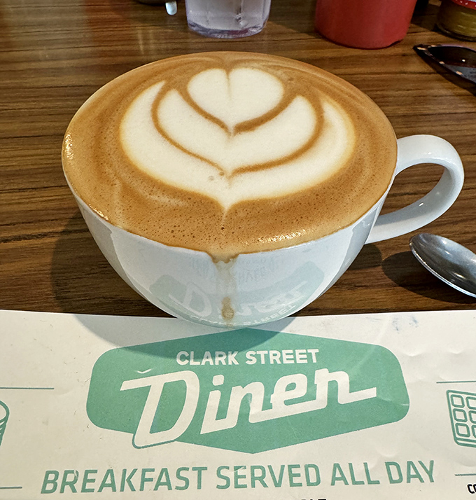 Coffee art so pretty you almost don't want to drink it. Almost. The Clark Street mug reminds you that good diners understand presentation matters.