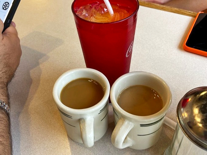 The unsung hero of breakfast&mdash;honest, no-nonsense coffee in classic diner mugs, ready to transform morning zombies into functioning humans.