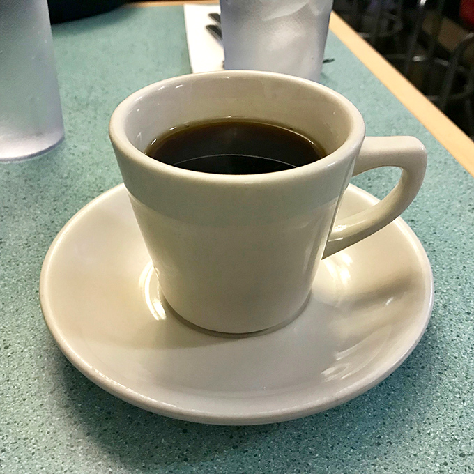 Diner coffee in a classic white mug – no fancy latte art needed when the coffee itself is this honest and straightforward.