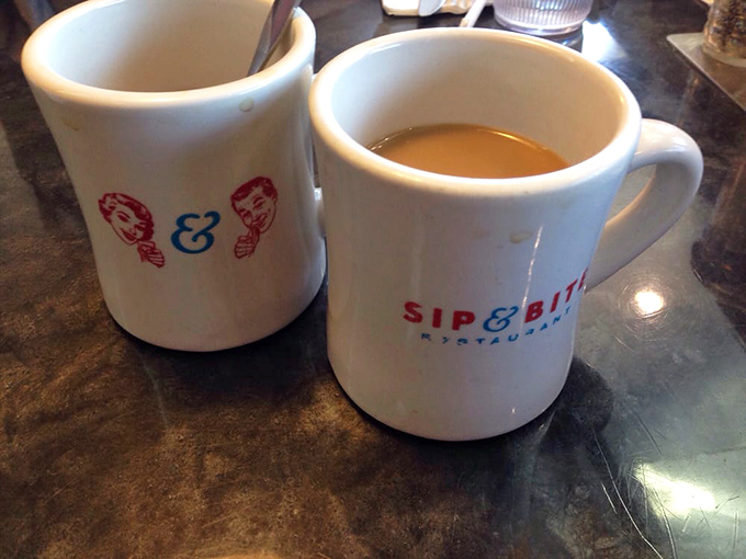 The unofficial fuel of America &ndash; Sip & Bite's coffee mugs promise warmth, caffeine, and the courage to face whatever Baltimore throws at you today.