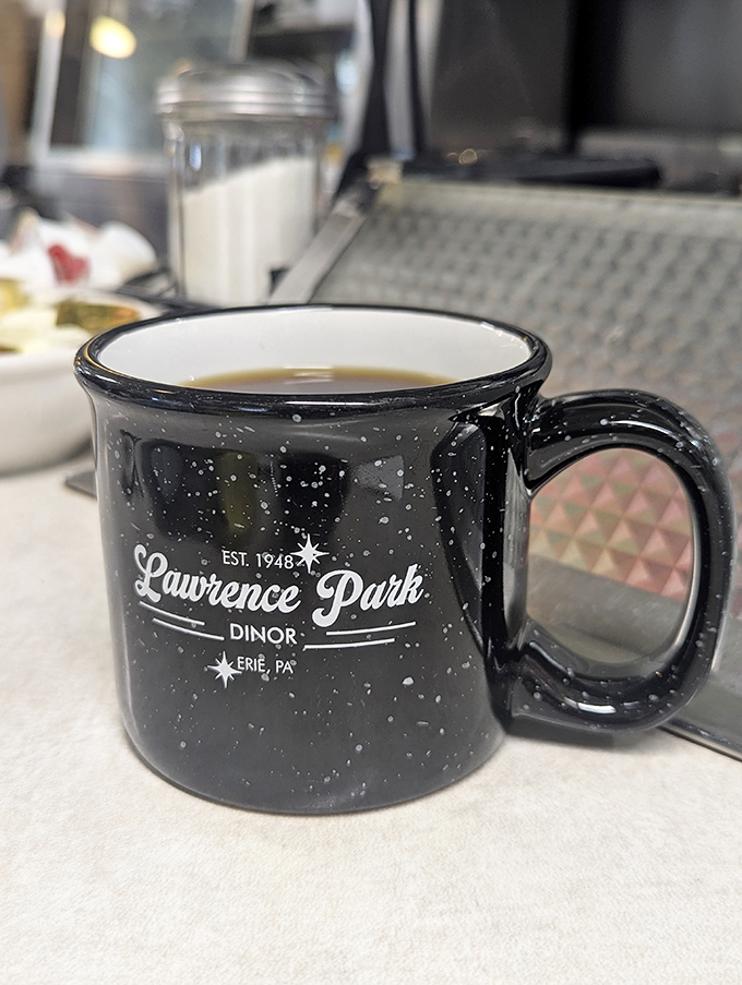 Coffee tastes better in a mug with character. This speckled Lawrence Park Dinor cup promises refills and local pride with every sip.