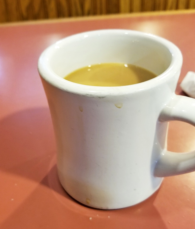 Coffee served in proper diner mugs &ndash; because fancy cups are for people who don't understand morning priorities.