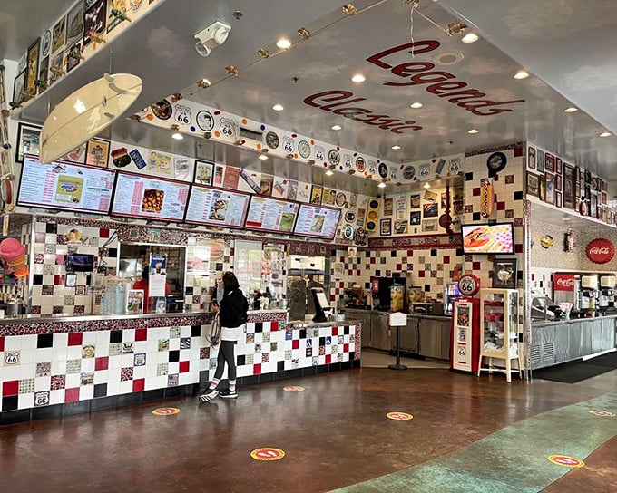 The counter area showcases the diner's soul—checkerboard tiles, nostalgic memorabilia, and the promise of comfort food served with a side of conversation.