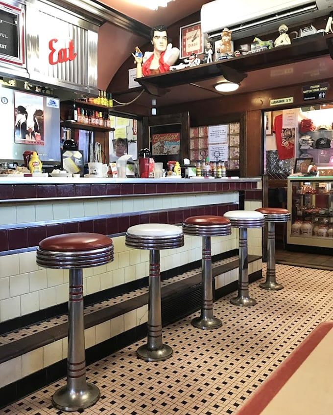 Counter seating where strangers become temporary friends, united by coffee and the shared belief that breakfast is the most important meal of the day.