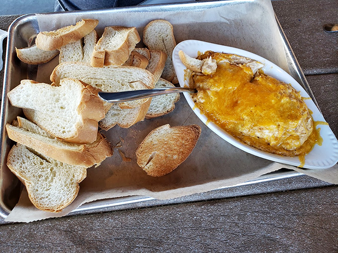 Comfort food gets fancy with this bubbling crab dip. Maryland meets barbecue in a cheese-topped romance that would make Shakespeare weep.