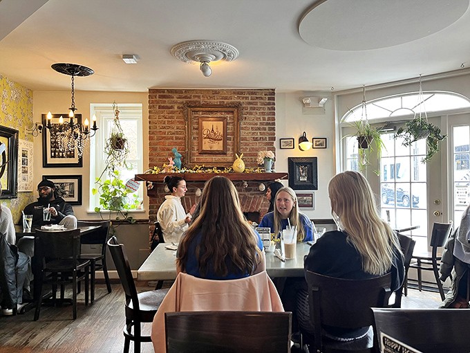 Where morning conversations bloom under exposed brick and hanging plants. The best tables aren't just about food&mdash;they're about the company you keep.
