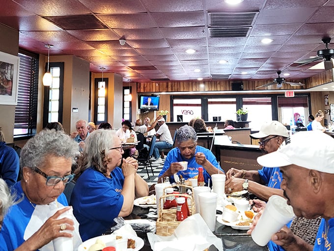 The dining room filled with happy customers &ndash; where strangers become temporary family, united by the universal language of "mmm" and "pass the napkins."